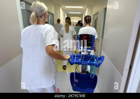 Medical staff including doctors and nurses at the CHRU de Nancy ...