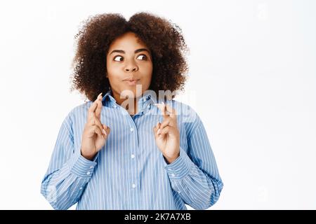 Image of black woman wishing, cross fingers and waiting for dream come ...