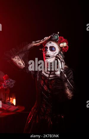 Spooky goddess talking on phone call with smartphone, wearing flowers ...