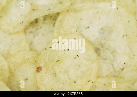Potato chips on a rotating surface. Close-up. Food Stock Photo - Alamy