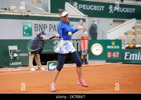 Elina Svitolina of Ukraine plays a forehand return to Wang Xinju of ...