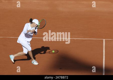 United States' Sofia Kenin plays a shot against Switzerland's Belinda ...