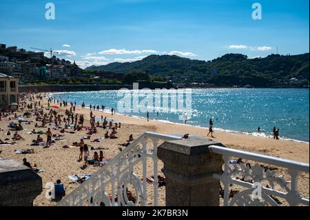 Walking near La Concha white sandy beach in San Sebastian or Donostia ...
