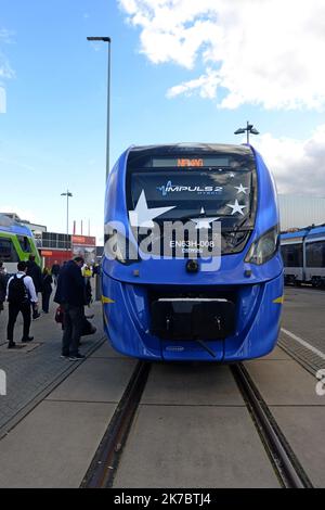 Railway Engineers examining new trains and displays at Innotrans ...