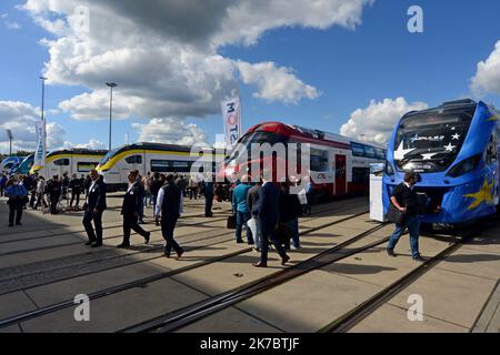 Railway Engineers examining new trains and displays at Innotrans ...