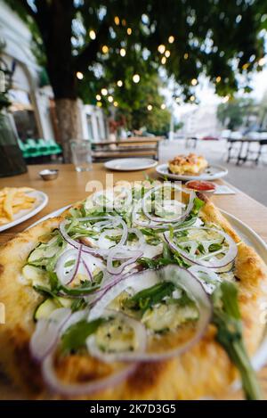Vegetarian pizza in street fast food outdoor cafe Stock Photo - Alamy