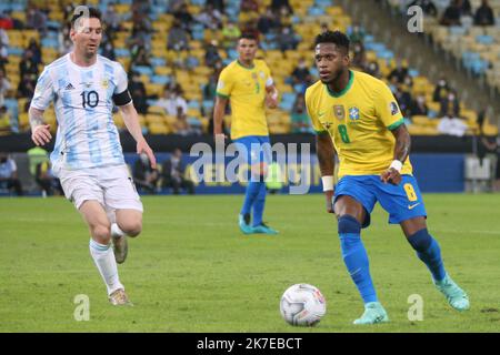 Lionel Messi of Argentina and Fred of Brazil During match between ...