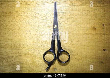 Plastic hair cutting scissors Isolated on wooden Background Stock Photo ...
