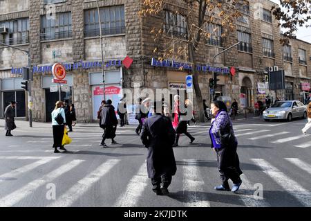 Pedestrians crossing the road at the ultra-Orthodox neighborhood of ...