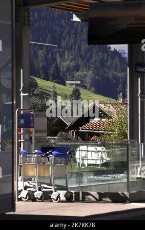 Railway station and Goldenpass train in Gstaad, Switzerland Stock Photo ...