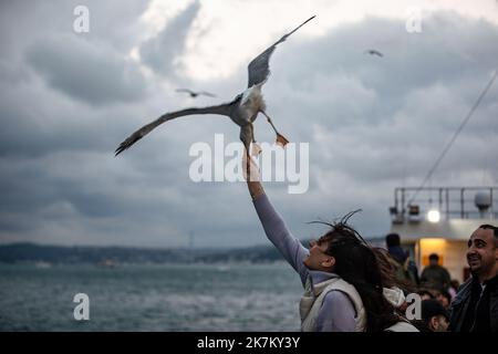 Passengers on the terrace of a city lines ferry are seen with the ...