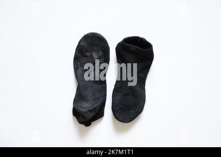dirty black female socks on a white background, worn socks Stock Photo ...