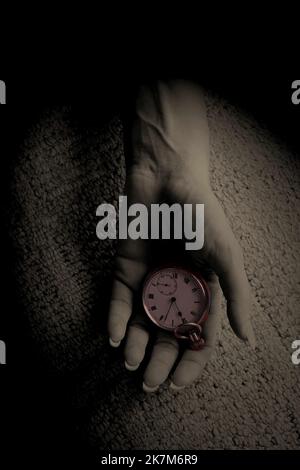Pocket watch laying on a white notebook page Stock Photo - Alamy