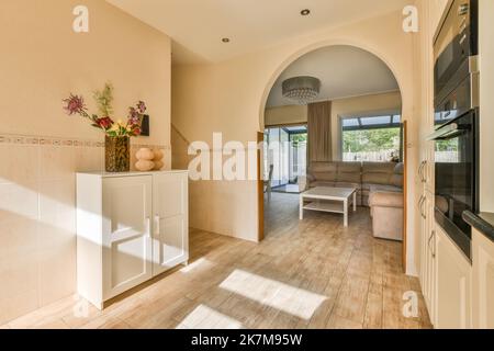 Modern home kitchen corner interior design with white cupboards and ...