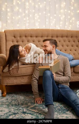 Spending nice time at home. Beautiful young loving couple bonding to ...