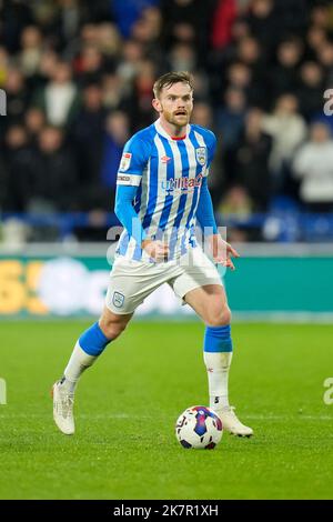 Oliver Turton #20 of Huddersfield Town makes a break with the ball in ...