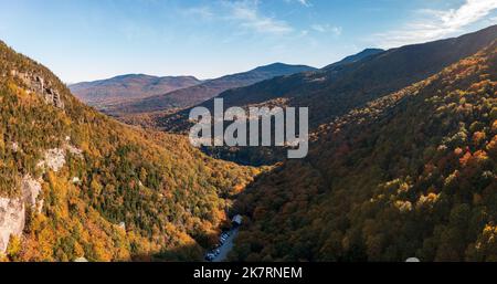 Aerial panorama of Smugglers Notch looking towards Stowe in fall colors ...