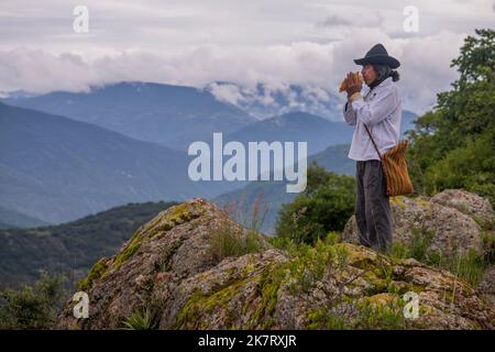 Zapotec guide Juan Santiago Hernandez is performing a traditional ...