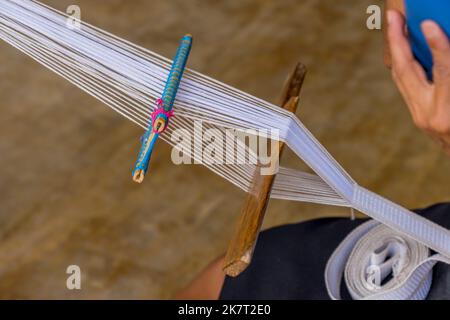 Close-up of a Back-strap Loom for weaving at the handicraft market in ...
