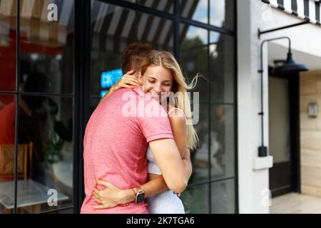 Farewell concept. Delighted happy smiling blonde woman says goodbye or ...