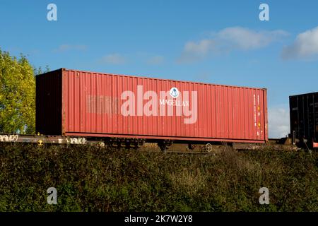 Magellan shipping container on a freightliner train, Warwickshire, UK ...