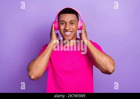 Portrait of toothy beaming man with fade hairstyle wear pink t-shirt ...