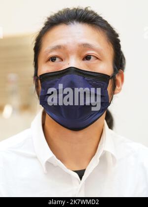 Hong Kong protester Bob Chan, left, who alleged he was dragged into the ...