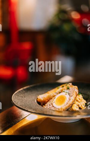 Traditional "Scotch egg". "Skirly" is fried oatmeal with onions and ...