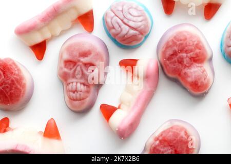 Halloween candy background. Skull, fangs and brain sweets Stock Photo ...