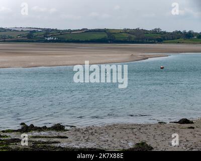 Silt on the exposed seabed at low tide. The shallow sea bay. Seaside ...