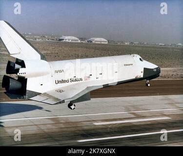 The NASA space shuttle prototype Enterprise is lowered by crane into ...