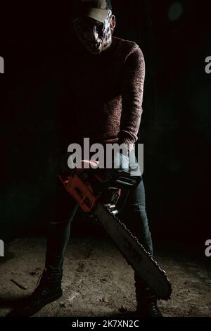 Horror character wearing mas and holding chainsaw, Halloween scary ...