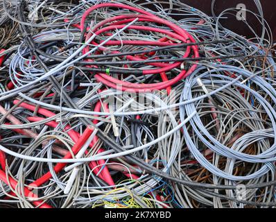 tangles of old used electrical cables in the landfill to be recycled ...