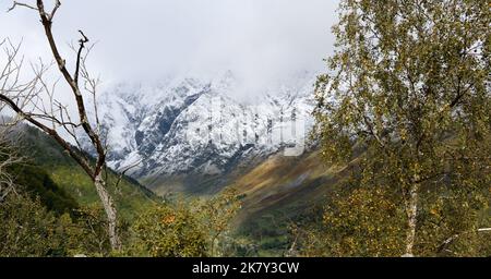 magnificent view of glacial valleys through to snow and cloud topped ...