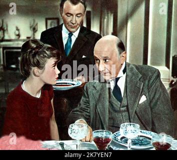 THE CHALK GARDEN, director Ronald Neame (left) listens intently as ...