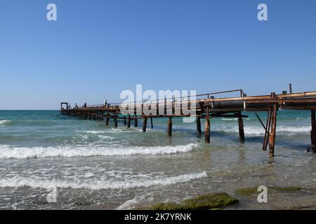 Fishermen on a Dock on Atlit Beach - Atlit Beach Reserve along Highway ...