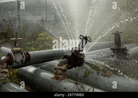 Pipe valve failure. Flow of boiling water. Steel pipe broke. Emergency ...