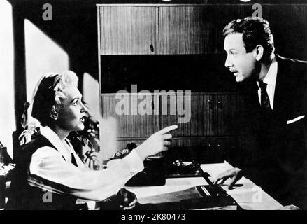 THE SOLID GOLD CADILLAC, director Richard Quine (right) with wife ...