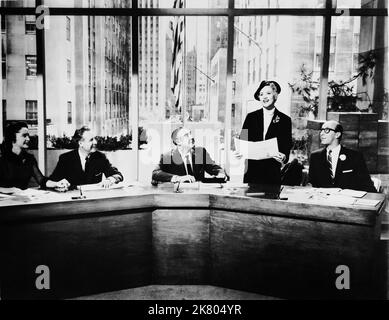 THE SOLID GOLD CADILLAC, director Richard Quine (right) with wife ...