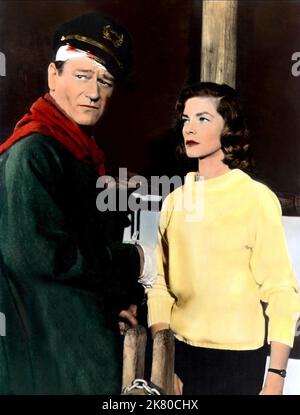 LAUREN BACALL and JOHN WAYNE in BLOOD ALLEY (1955), directed by WILLIAM ...