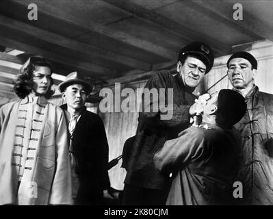 LAUREN BACALL and JOHN WAYNE in BLOOD ALLEY (1955), directed by WILLIAM ...