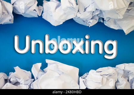 Unboxing text with Torn, Crumpled White Paper on colored background ...