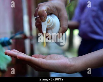 Students of Vivekananda High School are washing their hands before ...