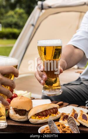 camping mood aesthetics drinking beer Stock Photo - Alamy