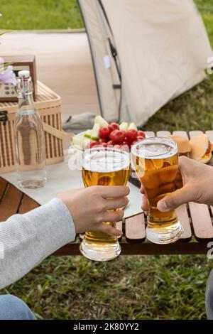 camping mood aesthetics drinking beer Stock Photo - Alamy