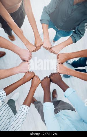 Teamwork collaboration, diversity fist bump and mission success of business. Partnership support ...