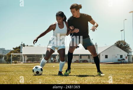 Friends playing soccer at field Stock Photo - Alamy