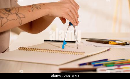 Cropped view of tattooed woman drawing on sketchbook,stock image Stock ...