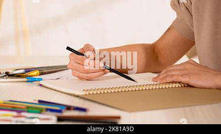 Cropped view of tattooed woman drawing on sketchbook,stock image Stock ...