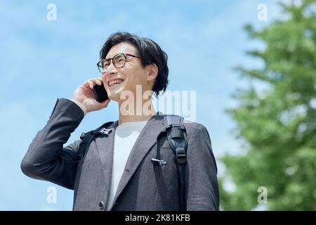 Japanese businessman talking on smartphone Stock Photo - Alamy